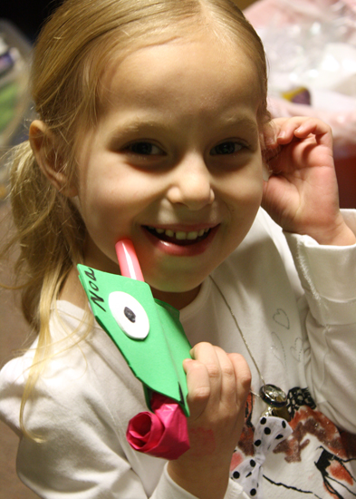 ( a party guest with her finished pascal blower )